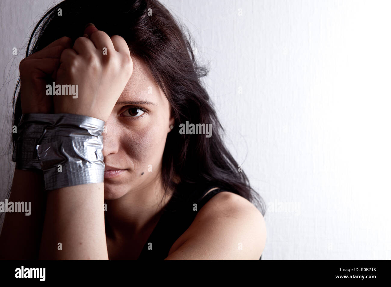 kidnapped young woman, hostage closeup on white background Stock Photo ...