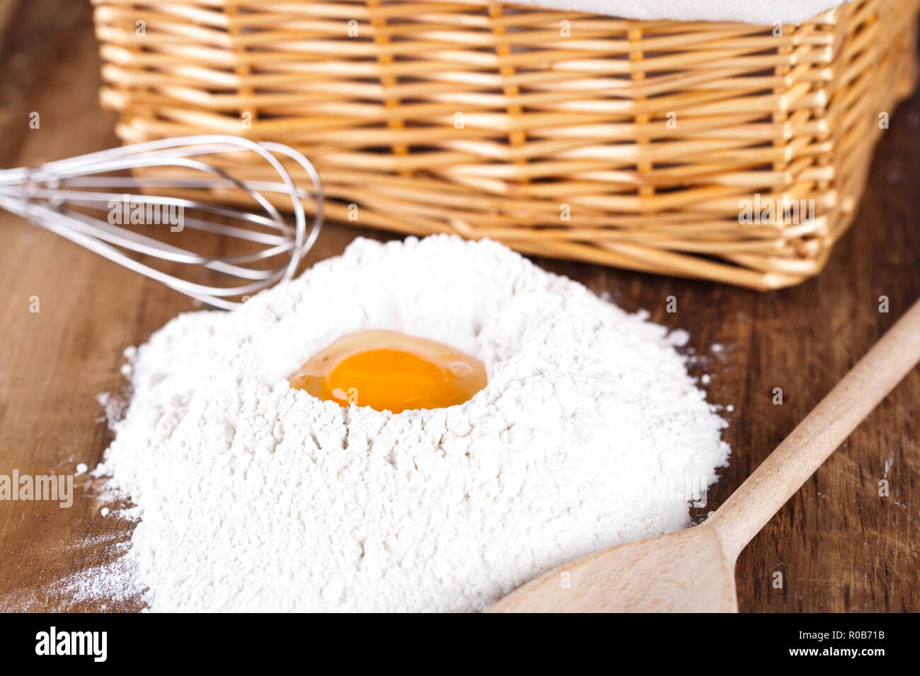 preparing for dough with eggs, flour and whisk Stock Photo - Alamy