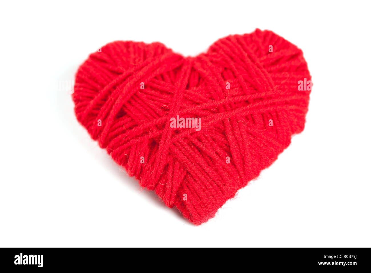 red thread heart isolated on white background Stock Photo - Alamy