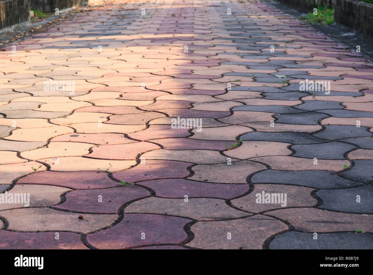 Stone block walk path in the park: Select focus with shallow depth of ...