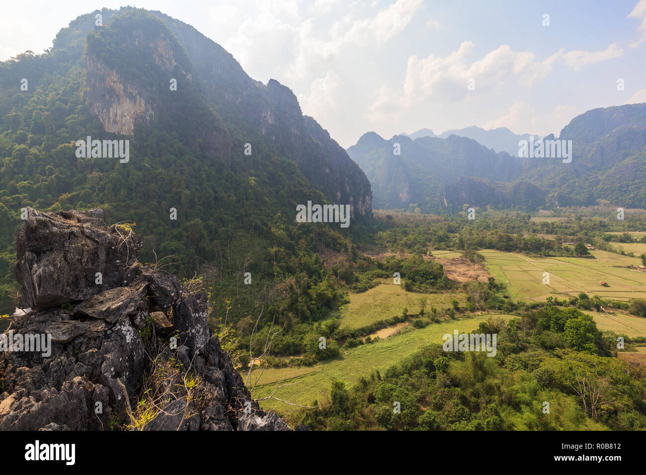 Beautiful view of fields and karst limestone mountains from above near ...