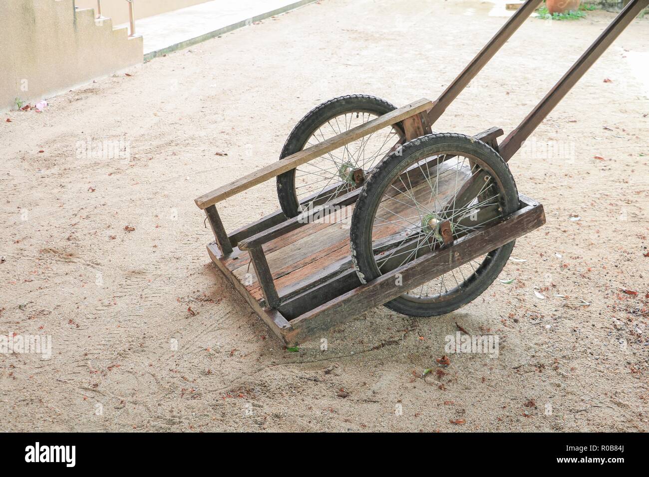 wooden barrow old two wheel Stock Photo - Alamy