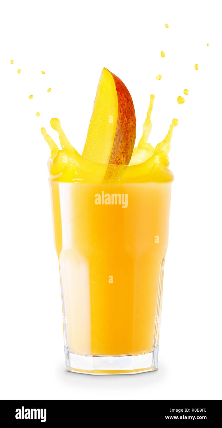 mango slice falling into glass with juice and creating splashes ...
