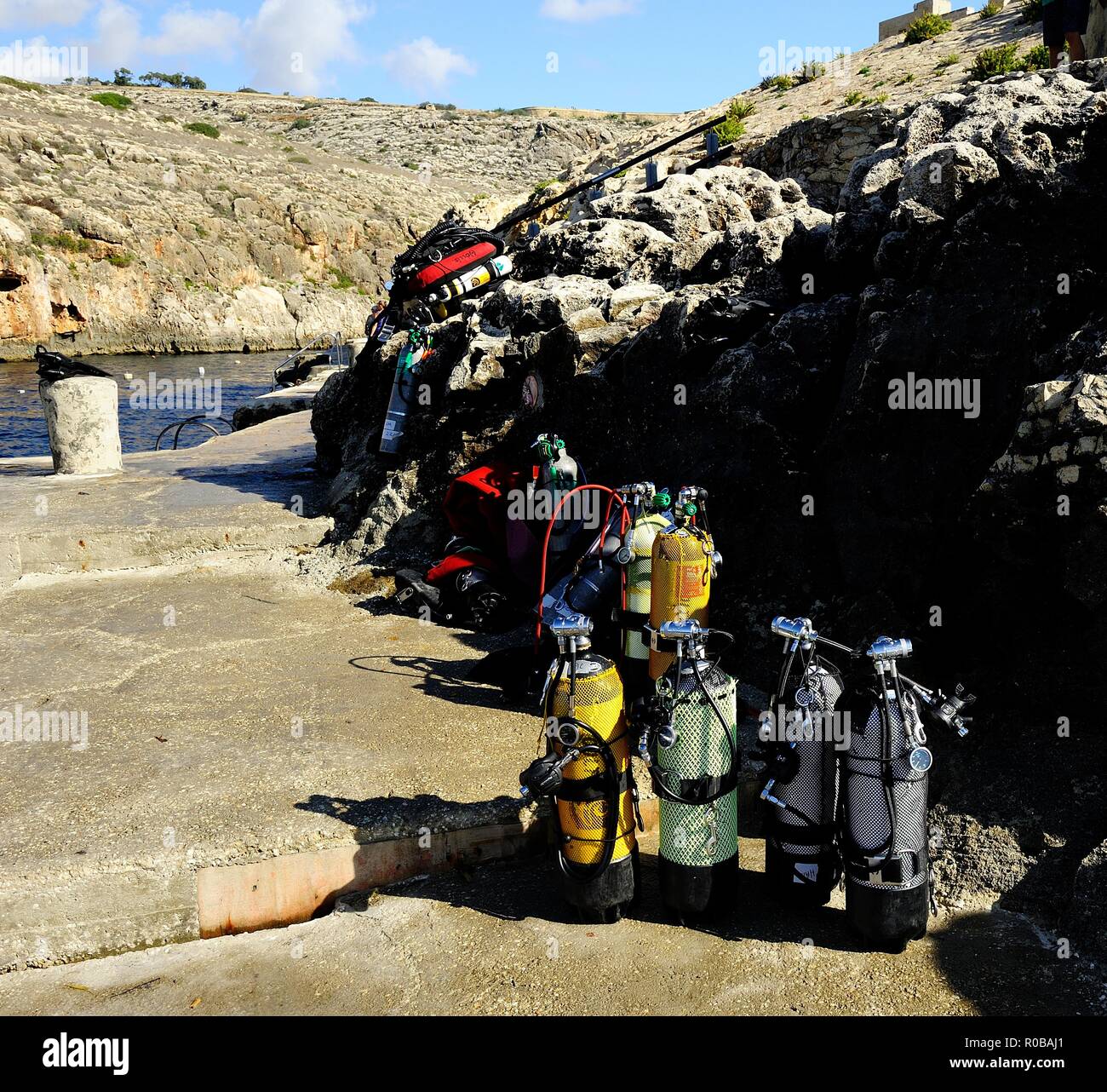 Lots of divers air tanks ready for a dive on the quayside Stock Photo ...
