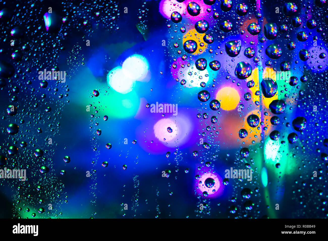 colored bokeh behind the splashes of water Stock Photo - Alamy