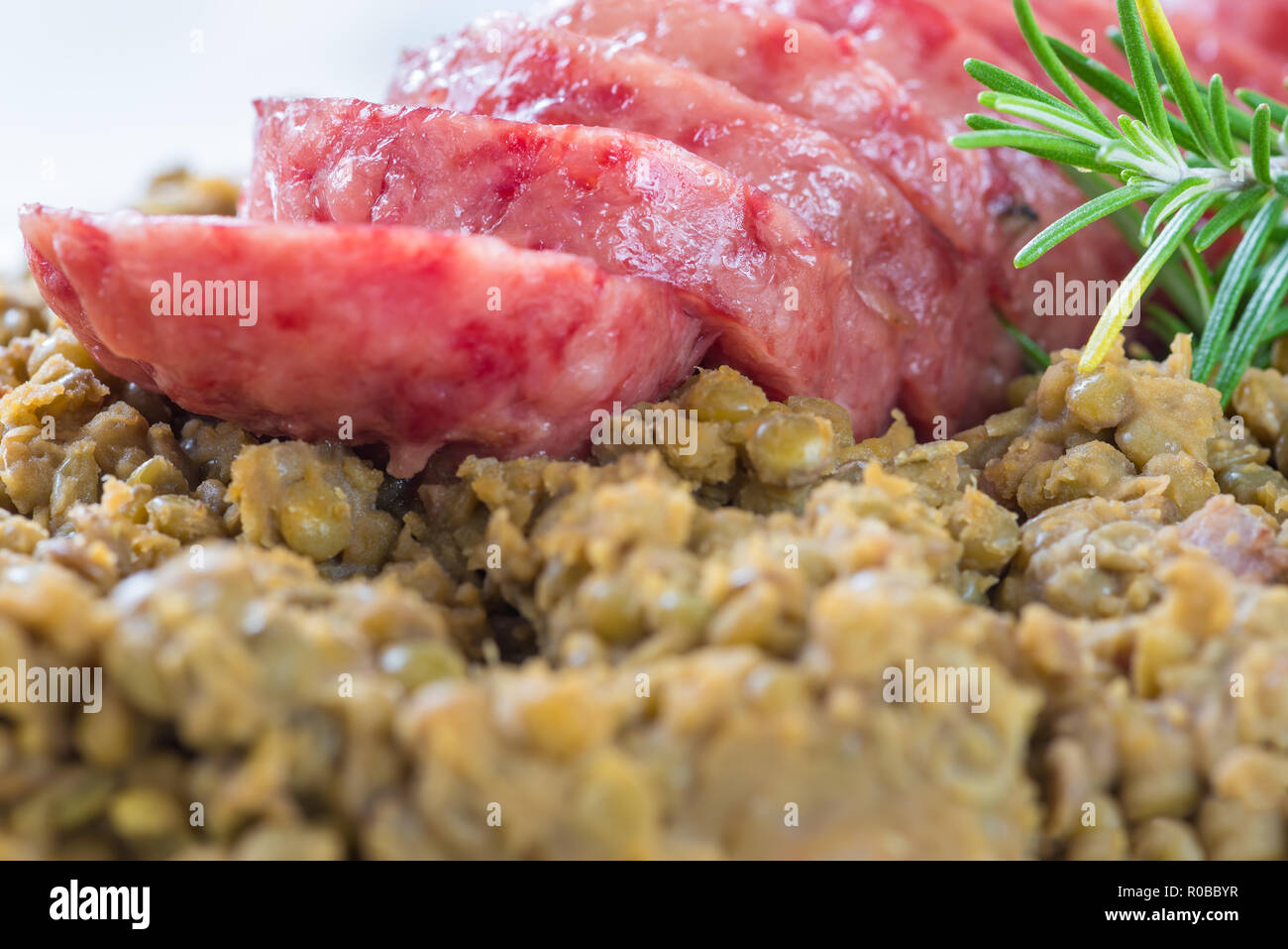 Cotechino (pork sausage) with lentils. Traditional Italian dish Stock ...