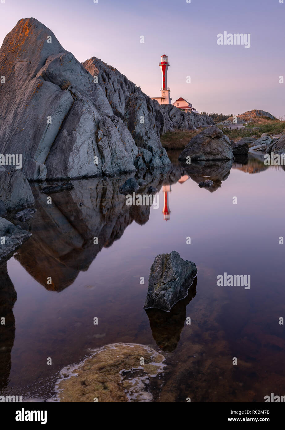 Reflection of Cape Forchu Lighthouse vertical Stock Photo - Alamy