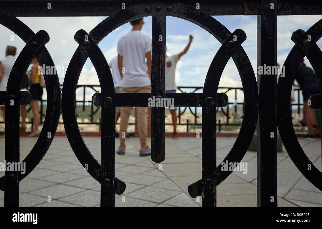 Close up of a wrought iron grating with deirto a reality of blurred ...