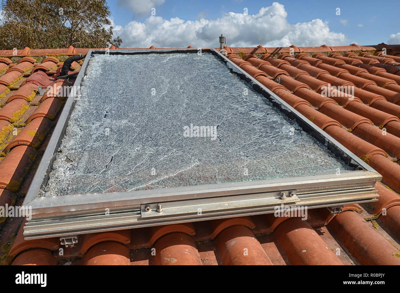 View of a shattered solar panel after hail Stock Photo - Alamy
