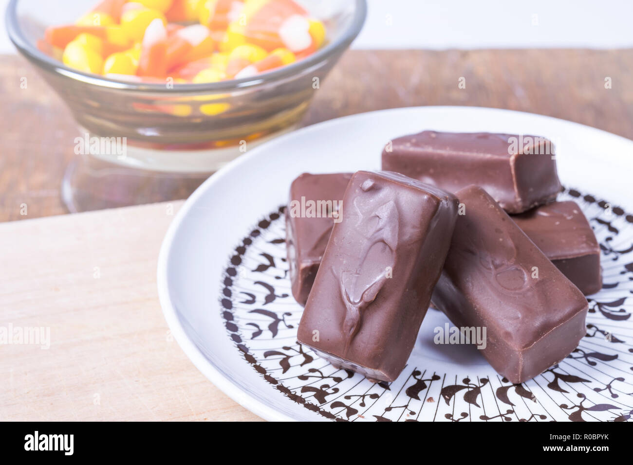 3 Chocolate Covered Candy Bars and Candy Corn Stock Photo - Alamy