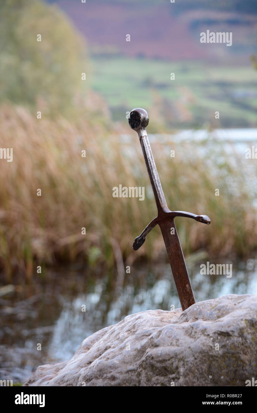 Excalibur the famous sword in the stone of king Arthur in the forest ...