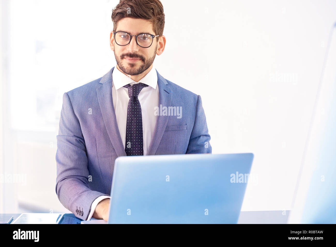 Portrait of executive financial advisor businessman wearing suit and ...