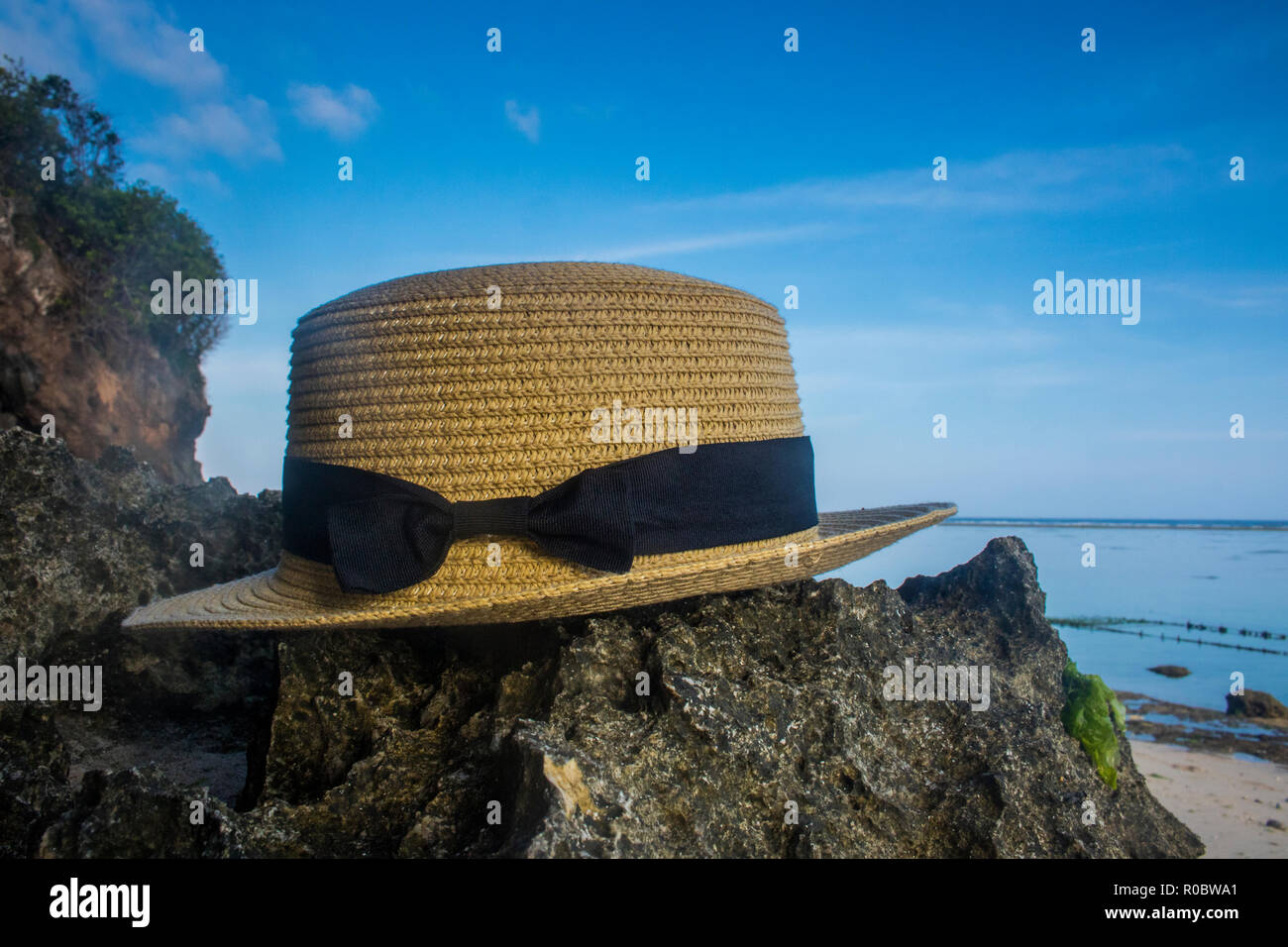 woman beach hat on reef beach summer holiday Stock Photo - Alamy