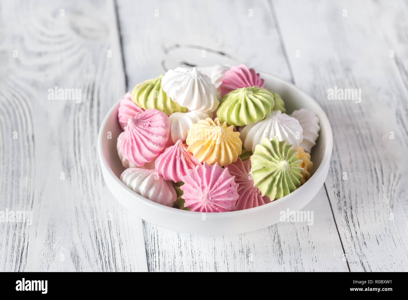 Bowl of colored meringues Stock Photo - Alamy