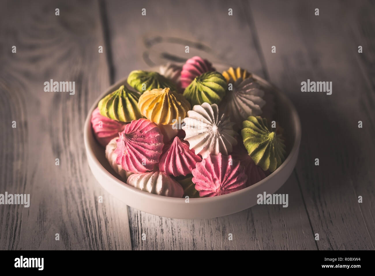 Bowl of colored meringues Stock Photo - Alamy