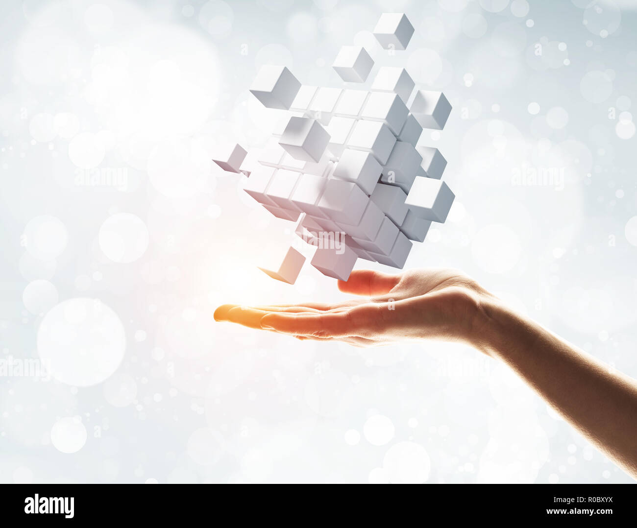 Cube white figure in male palm as symbol for integration. 3D rendering ...