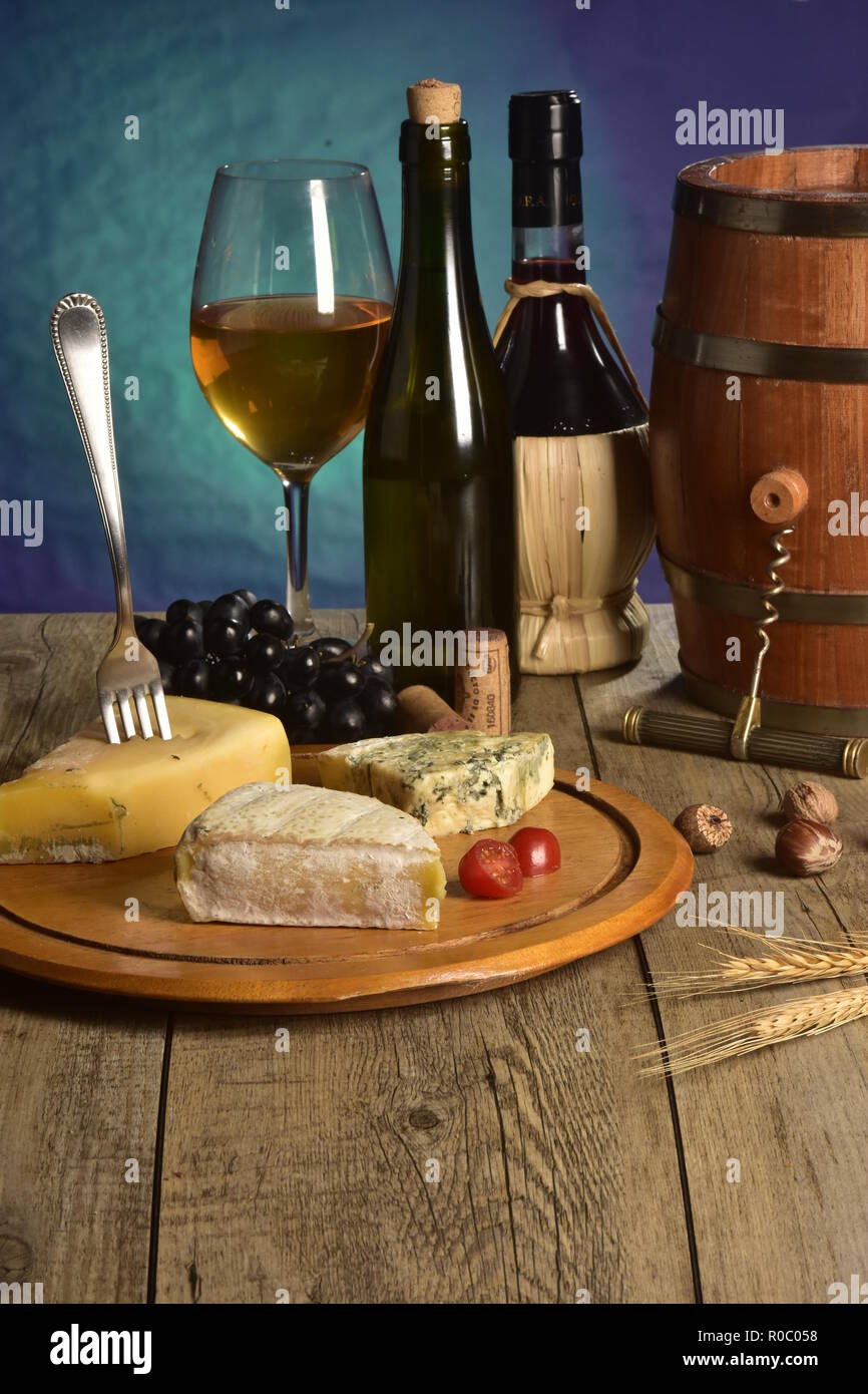 Beverages and a table of assorted cheese Stock Photo - Alamy
