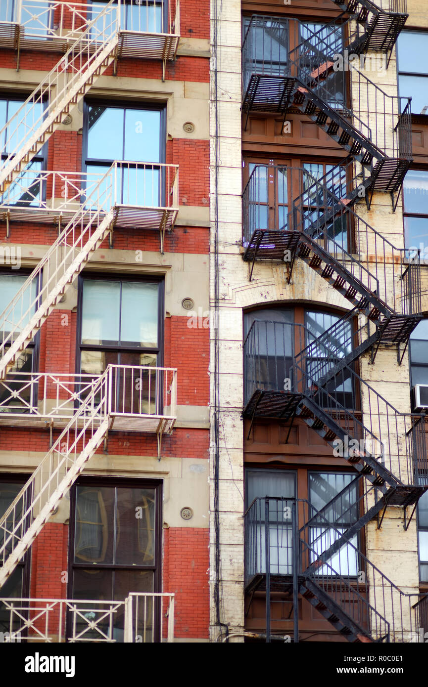 Close-up view of New York City apartment buildings with emergency ...