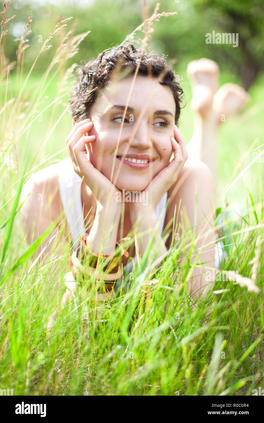 happy cute girl on green field Stock Photo - Alamy