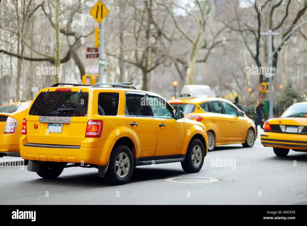 Yellow taxi cabs and people rushing on busy streets of downtown ...