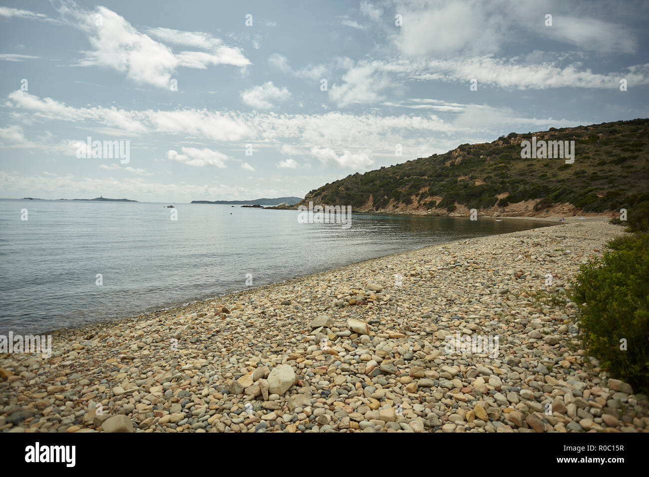 Natural beach made of pebbles in a natural bay nelsud of Sardinia Stock ...