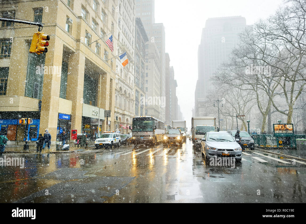 NEW YORK - MARCH 19, 2015: Cars, taxi cabs and people rushing on busy ...