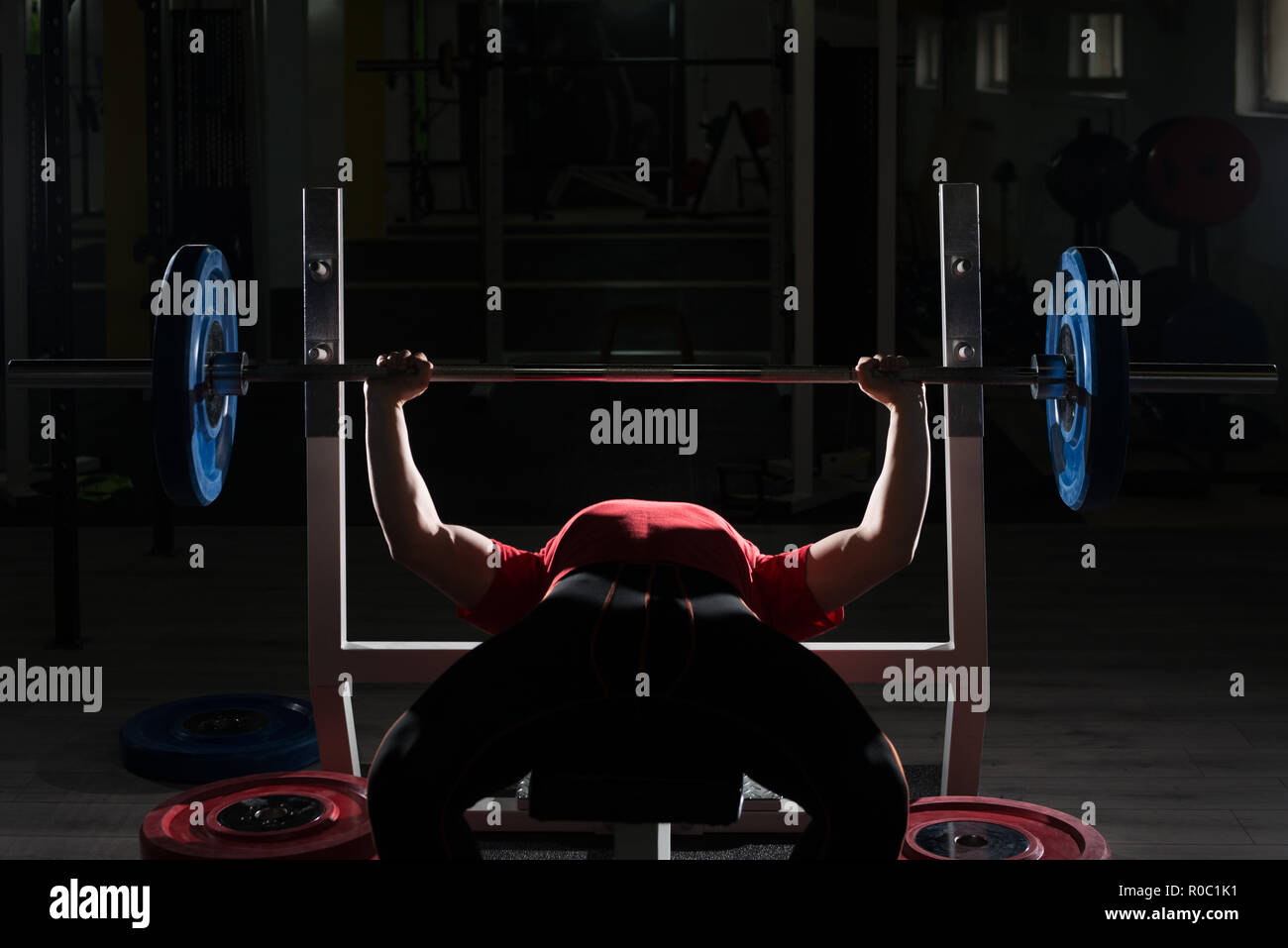 Strong Man Lifting Heavy Barbell During Powerlifting Workout in Gym ...