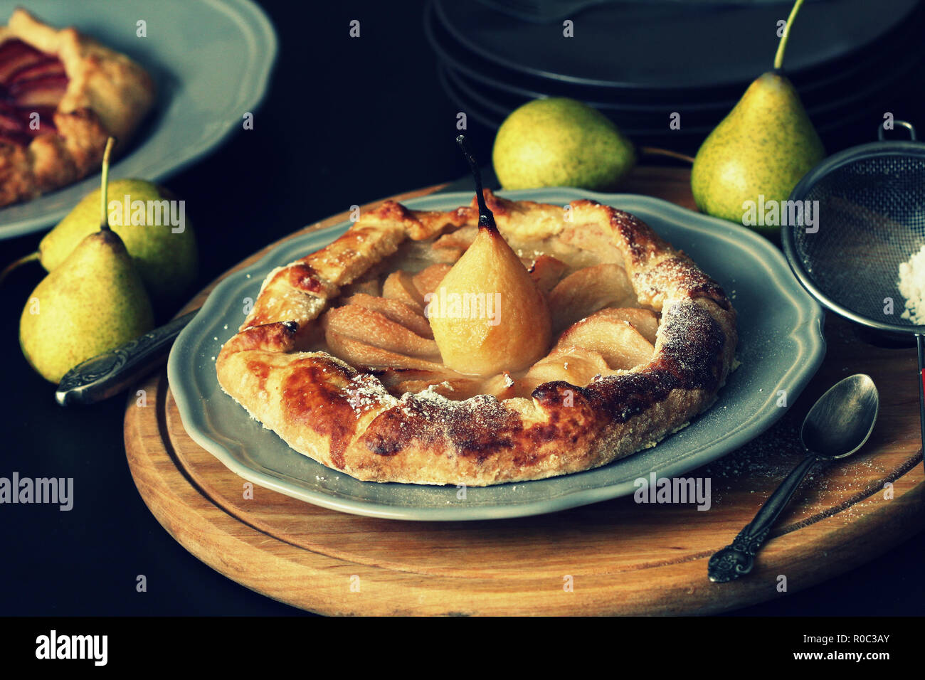 Homemade galette with pears on dark background. Sweet open fruit pie ...