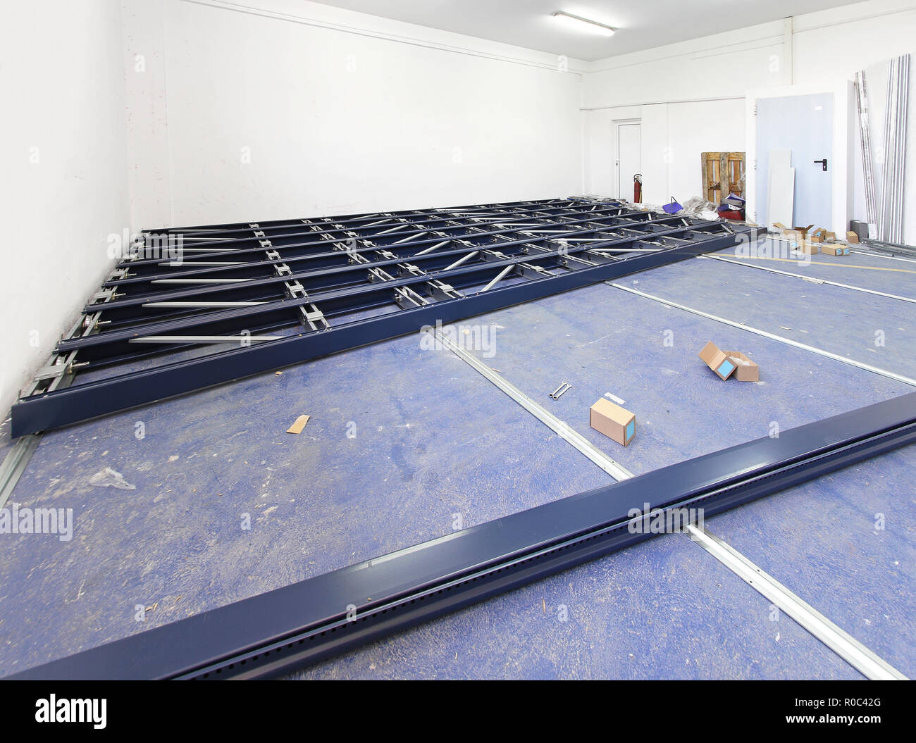 Automated shelving system during construction in empty storage room ...