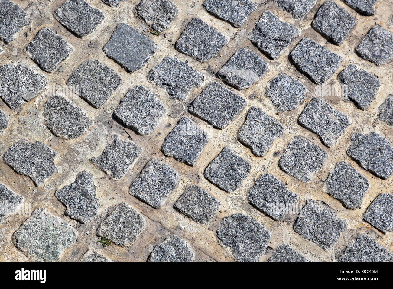 Diagonal structure of old style cobblestones pavement Stock Photo - Alamy