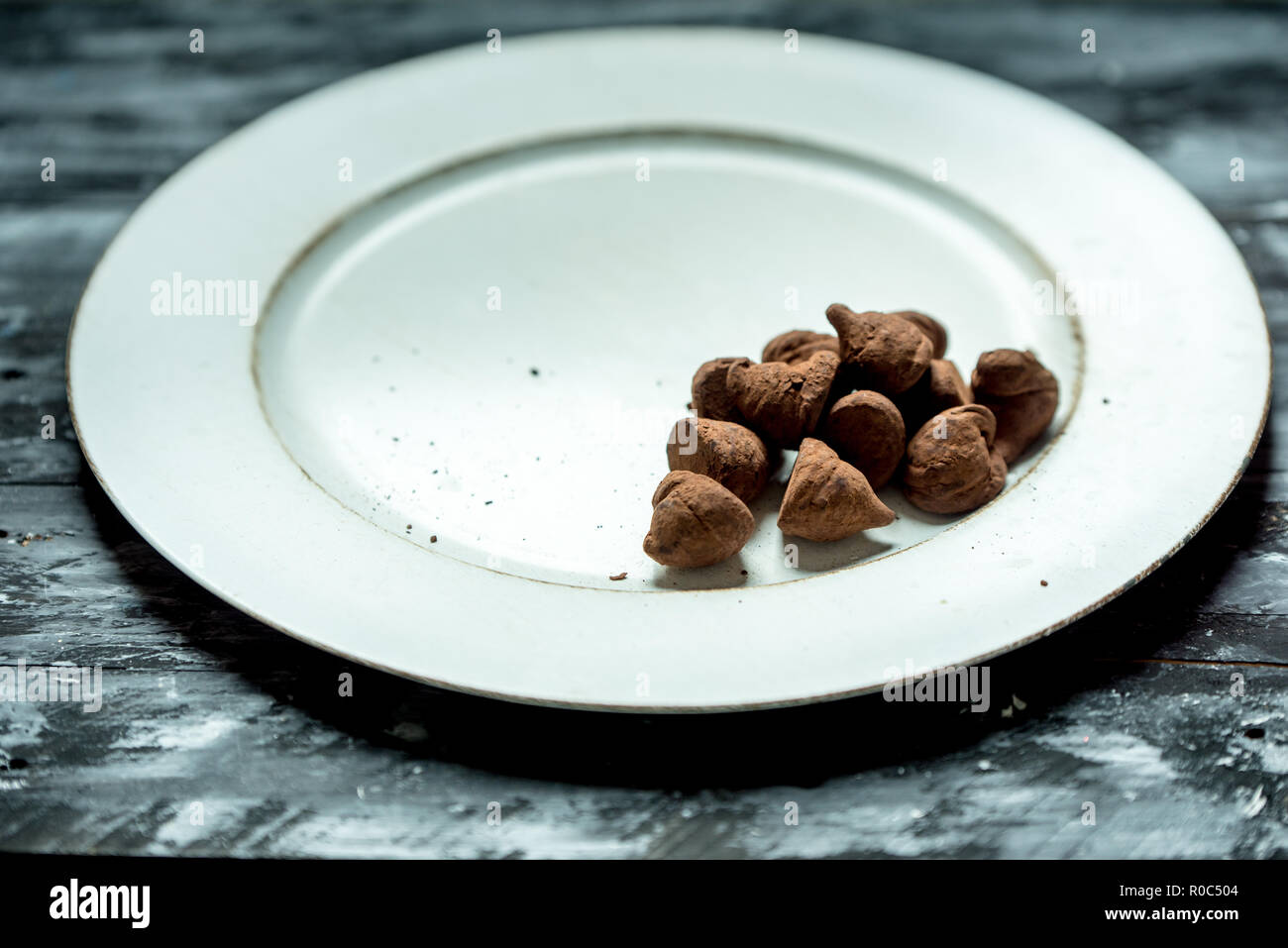 sweet, chocolate truffles and bitter cocoa on a romantic, dark ...