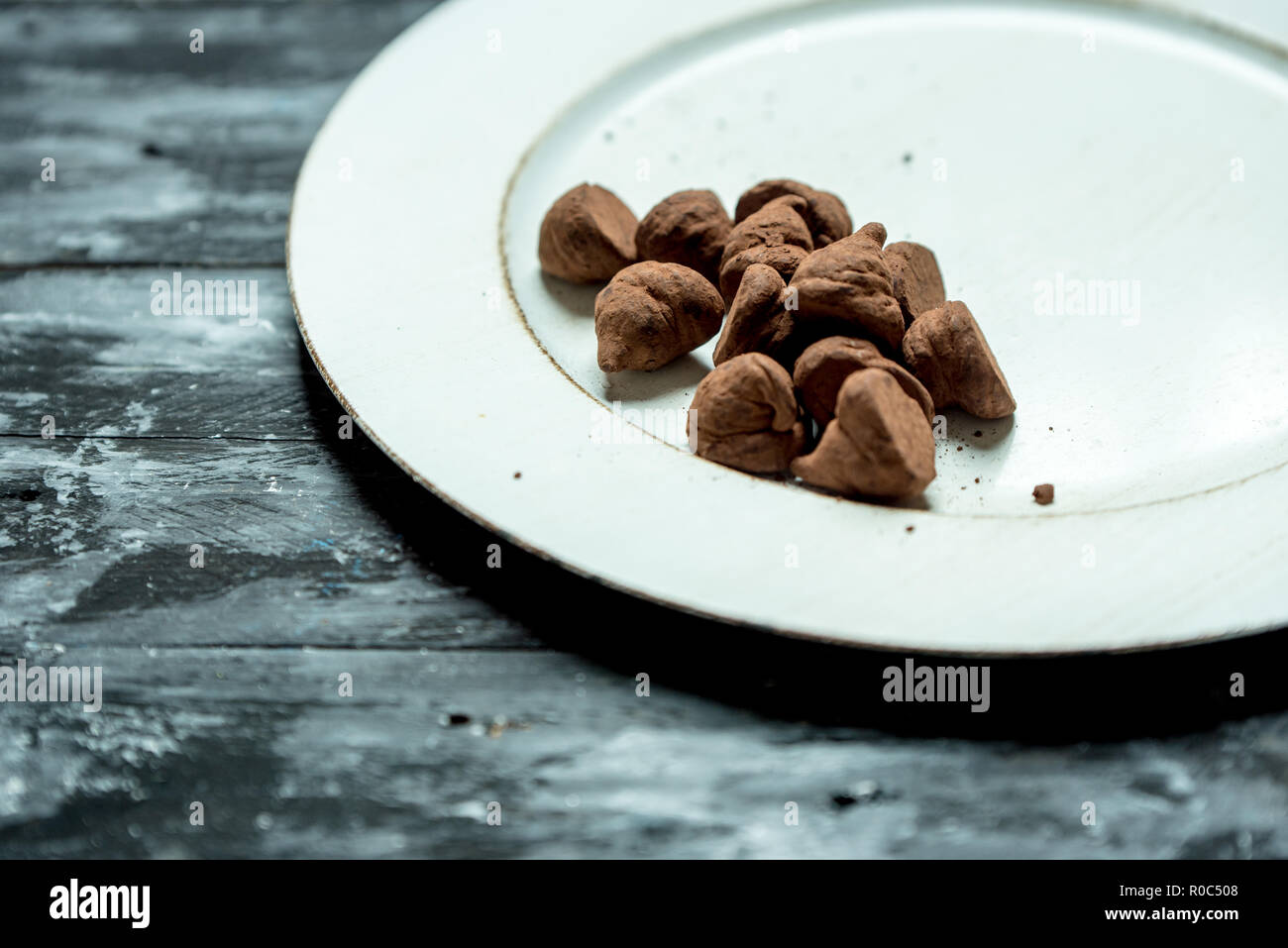 sweet, chocolate truffles and bitter cocoa on a romantic, dark ...