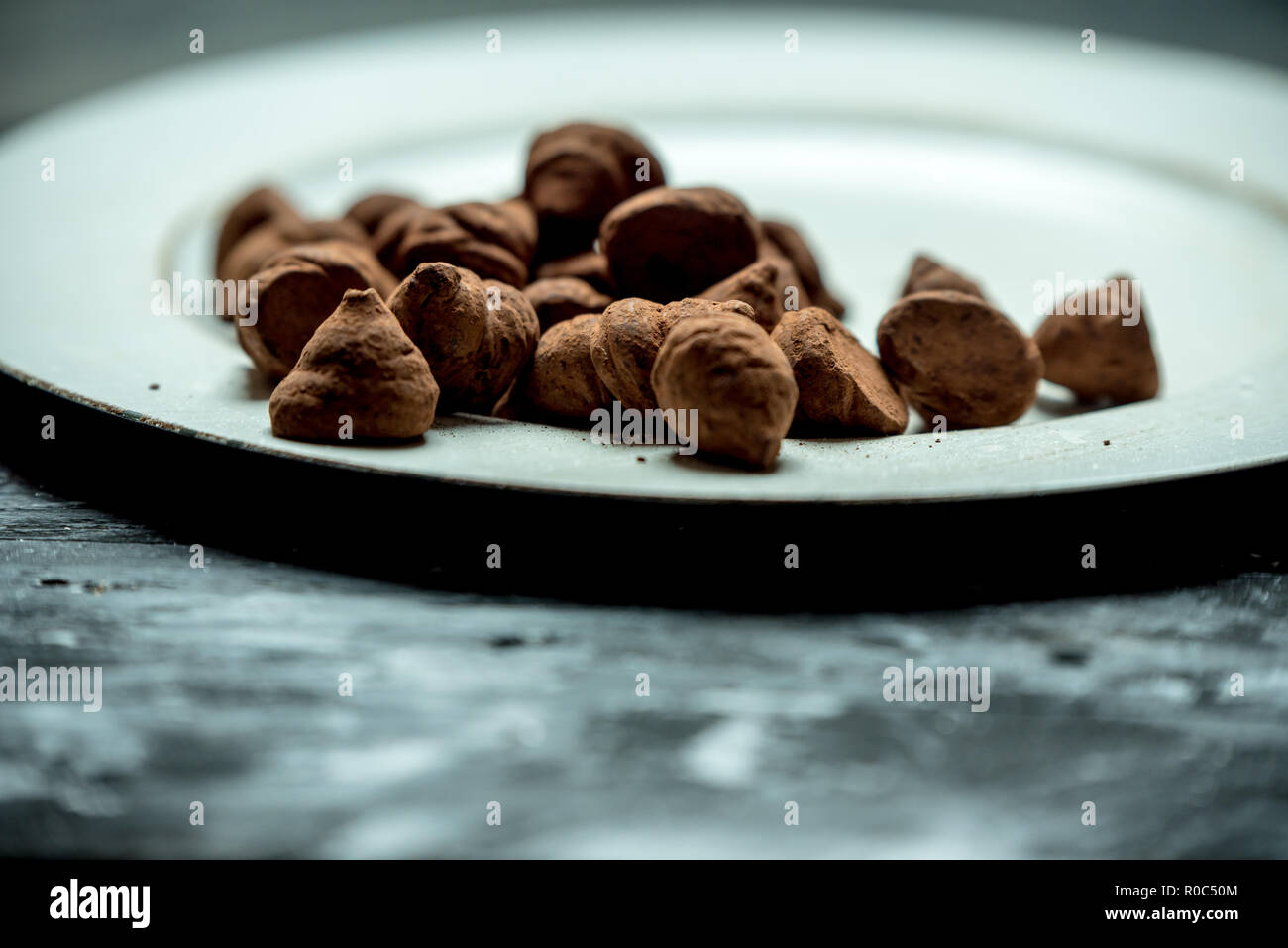 sweet, chocolate truffles and bitter cocoa on a romantic, dark ...