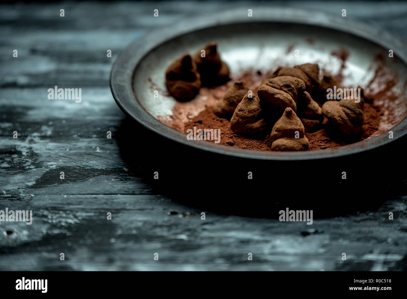 sweet, chocolate truffles and bitter cocoa on a romantic, dark ...