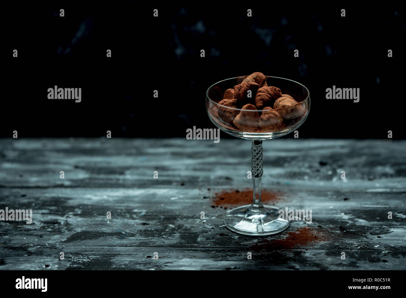 sweet, chocolate truffles and bitter cocoa on a romantic, dark ...