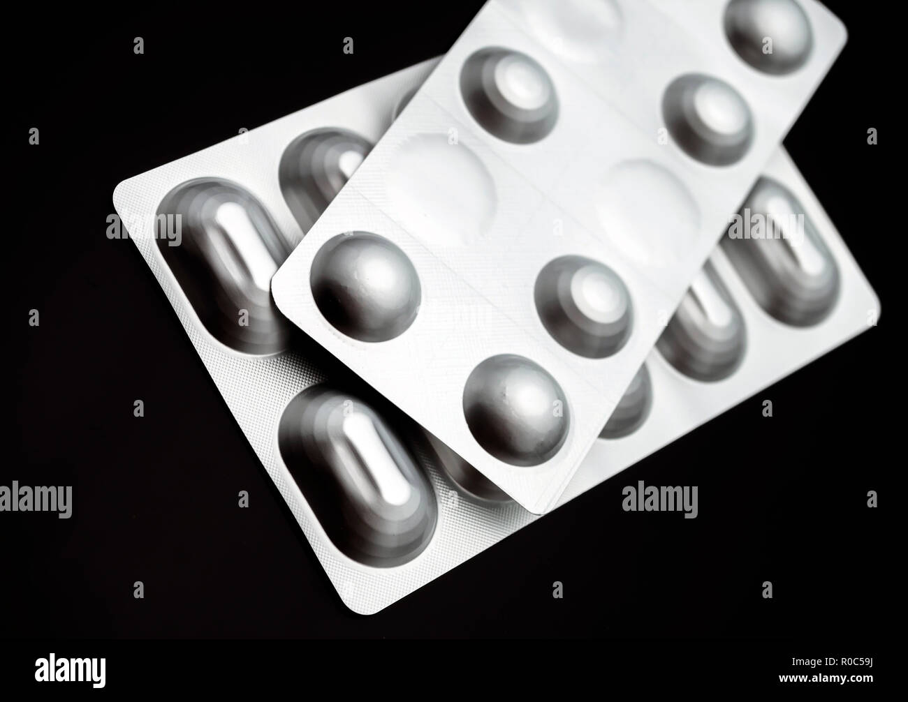Many Medicines Pills Capsules Of Diferent Size Stock Photo - Alamy