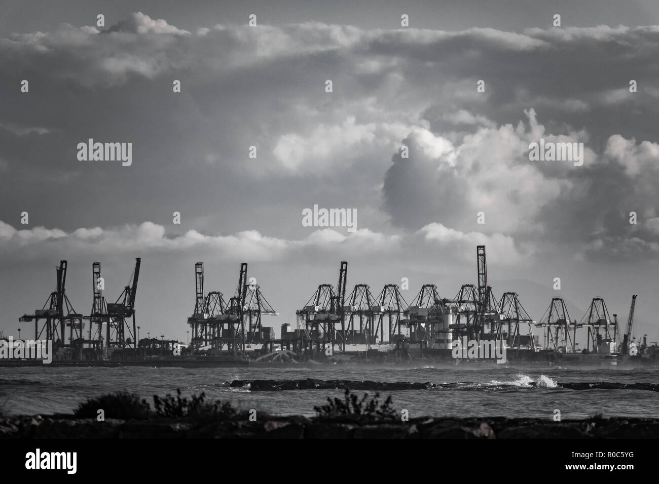 Huge industrial cranes in commercial port horizon Stock Photo - Alamy