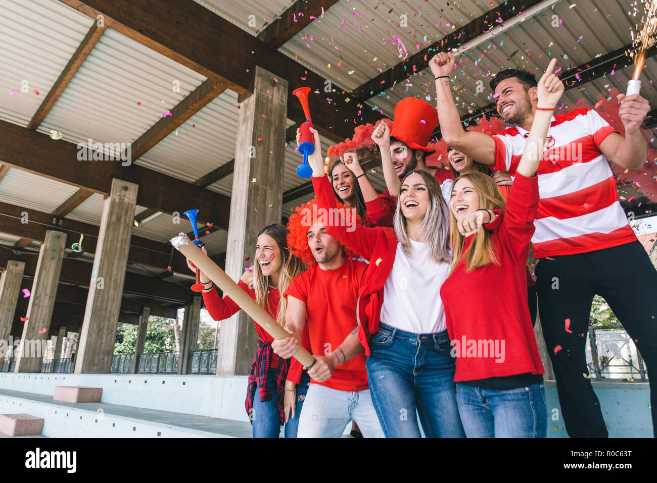 Football supporters at the stadium - Football fans having fun and ...