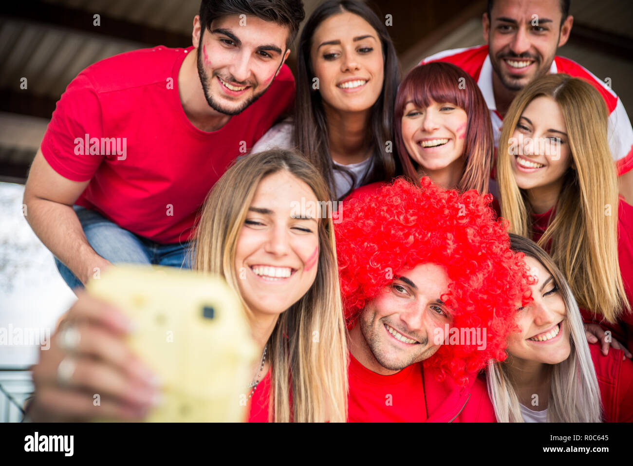 Football supporters at the stadium - Football fans having fun and ...