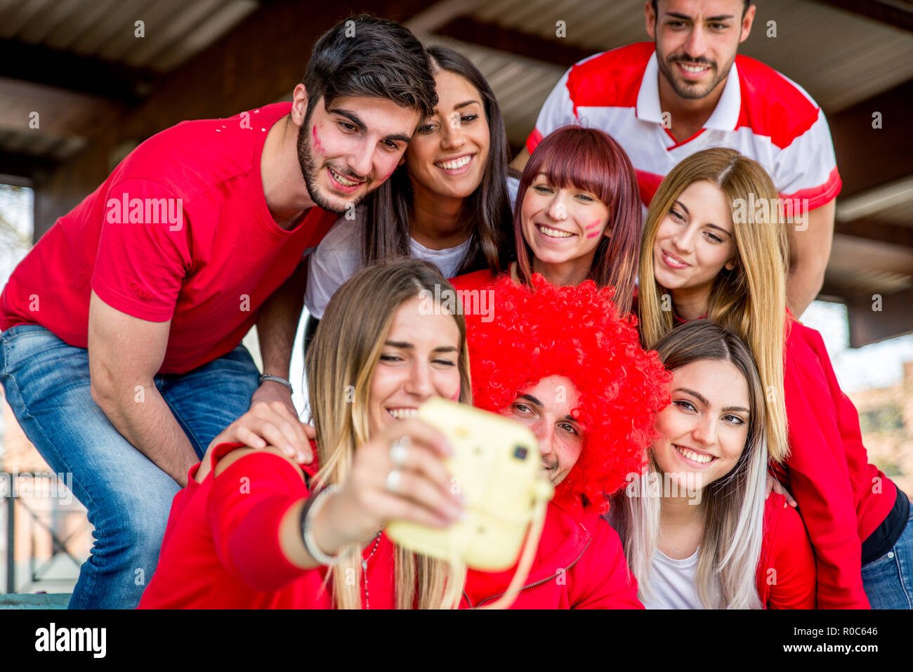 Football supporters at the stadium - Football fans having fun and ...