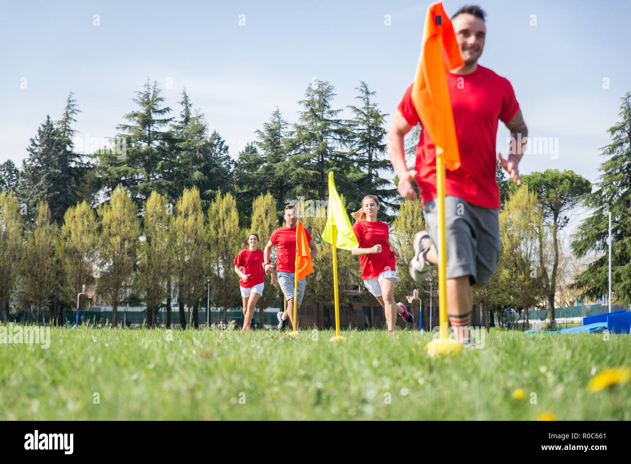 Football players training in soccer field, concepts about teamwork and ...