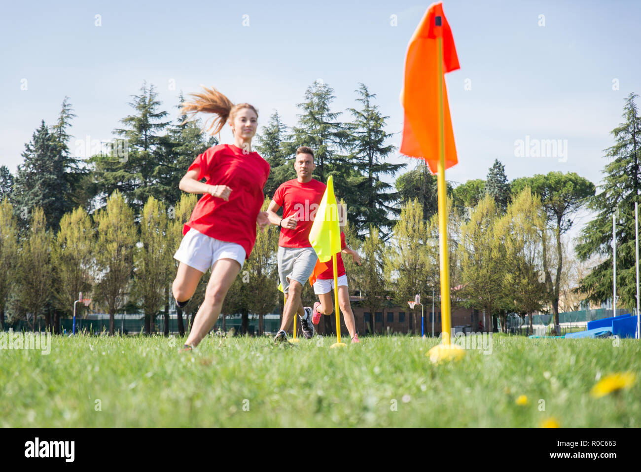 Football players training in soccer field, concepts about teamwork and ...