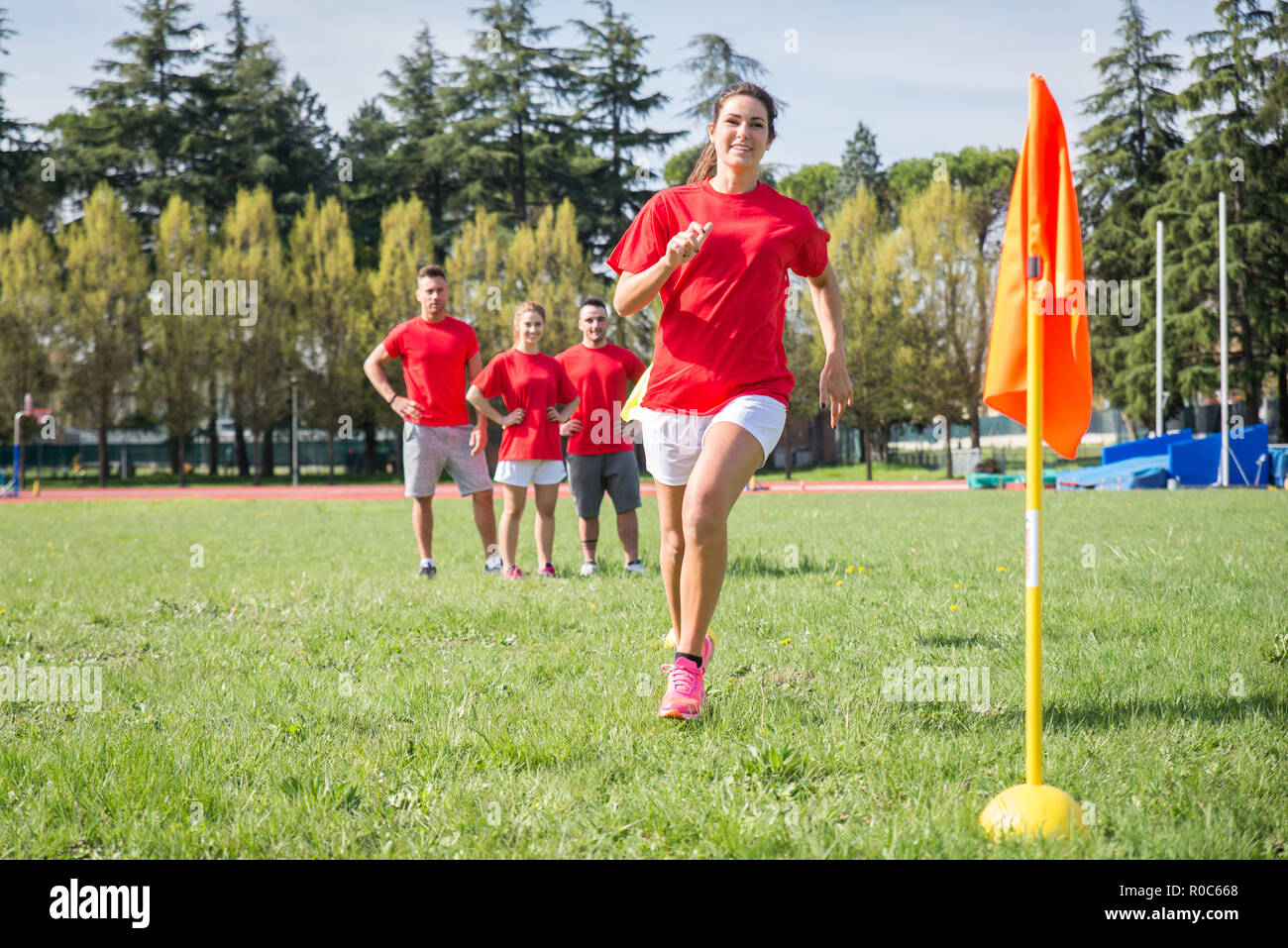 Football players training in soccer field, concepts about teamwork and ...
