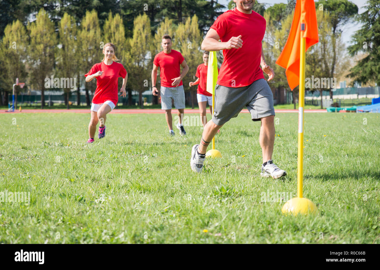Football players training in soccer field, concepts about teamwork and ...