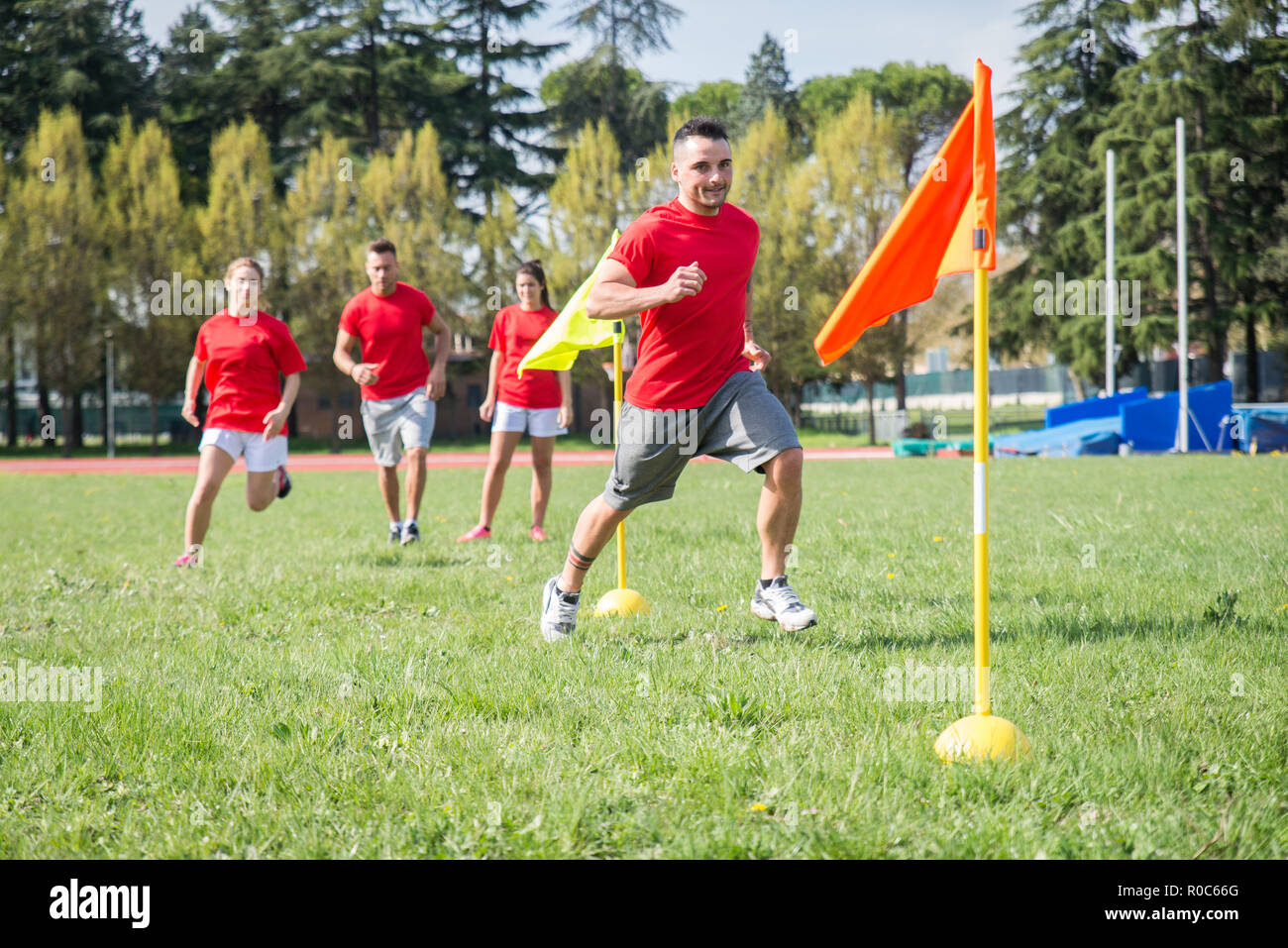 Football players training in soccer field, concepts about teamwork and ...
