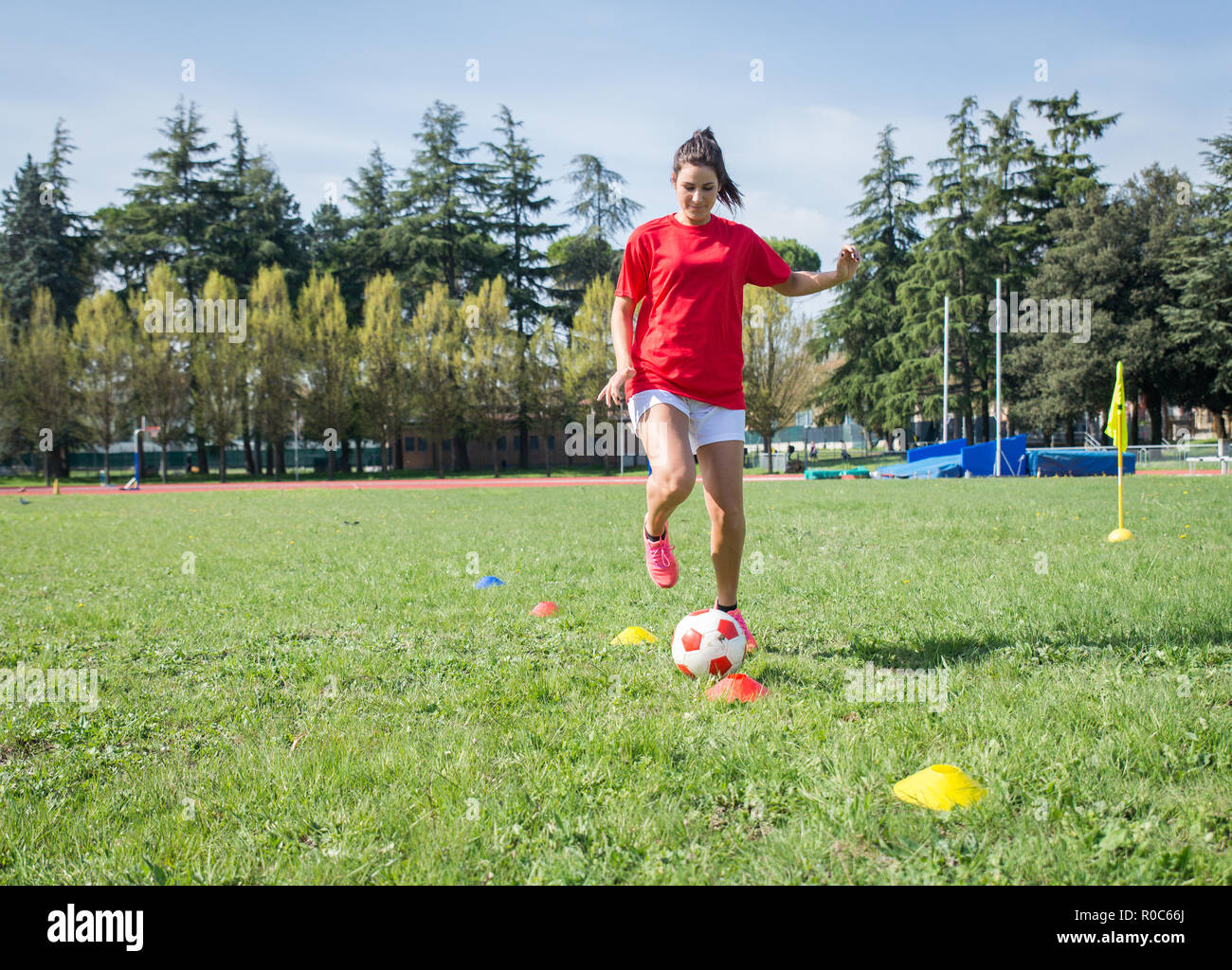 Football players training in soccer field, concepts about teamwork and ...