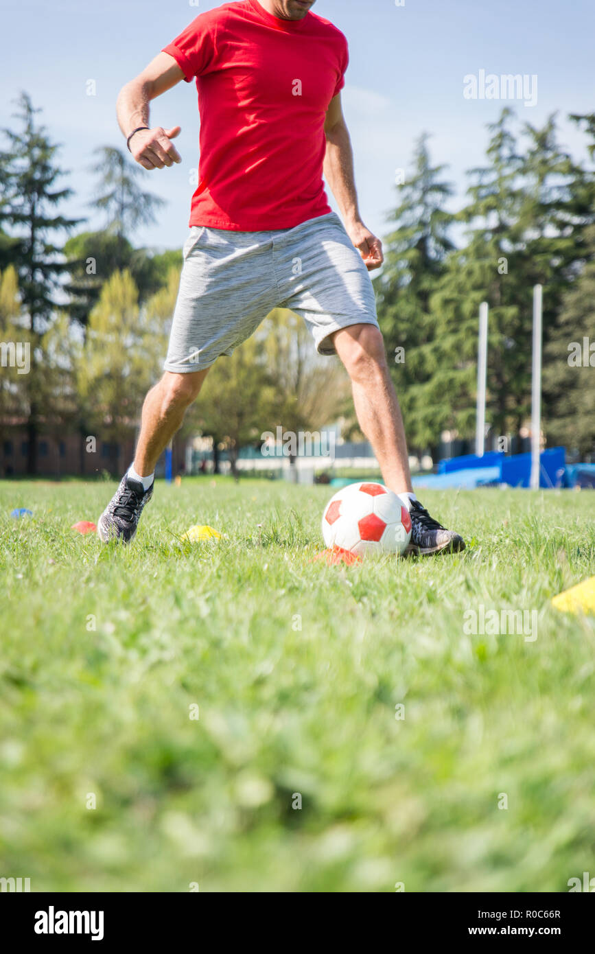 Football players training in soccer field, concepts about teamwork and ...