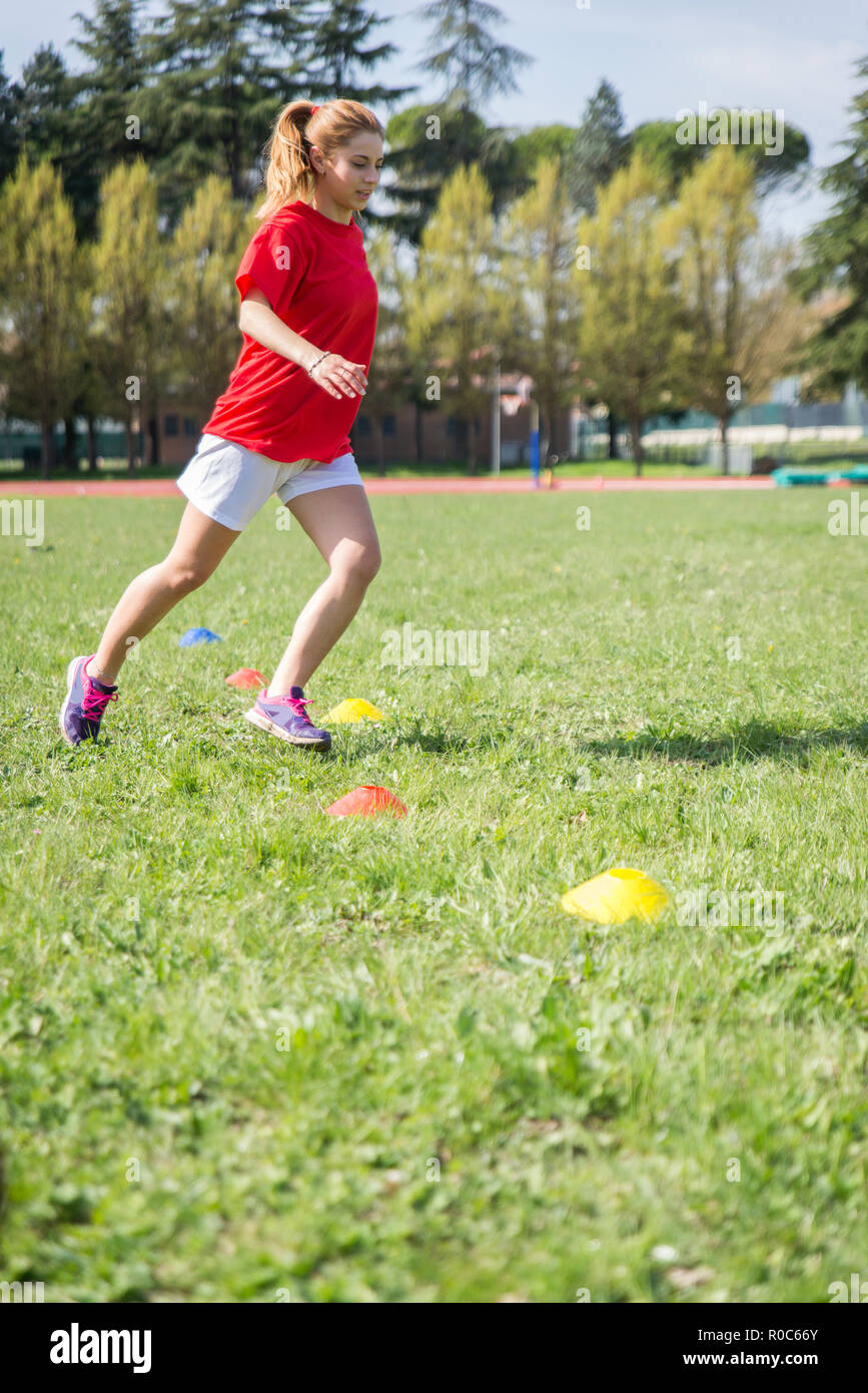 Football players training in soccer field, concepts about teamwork and ...