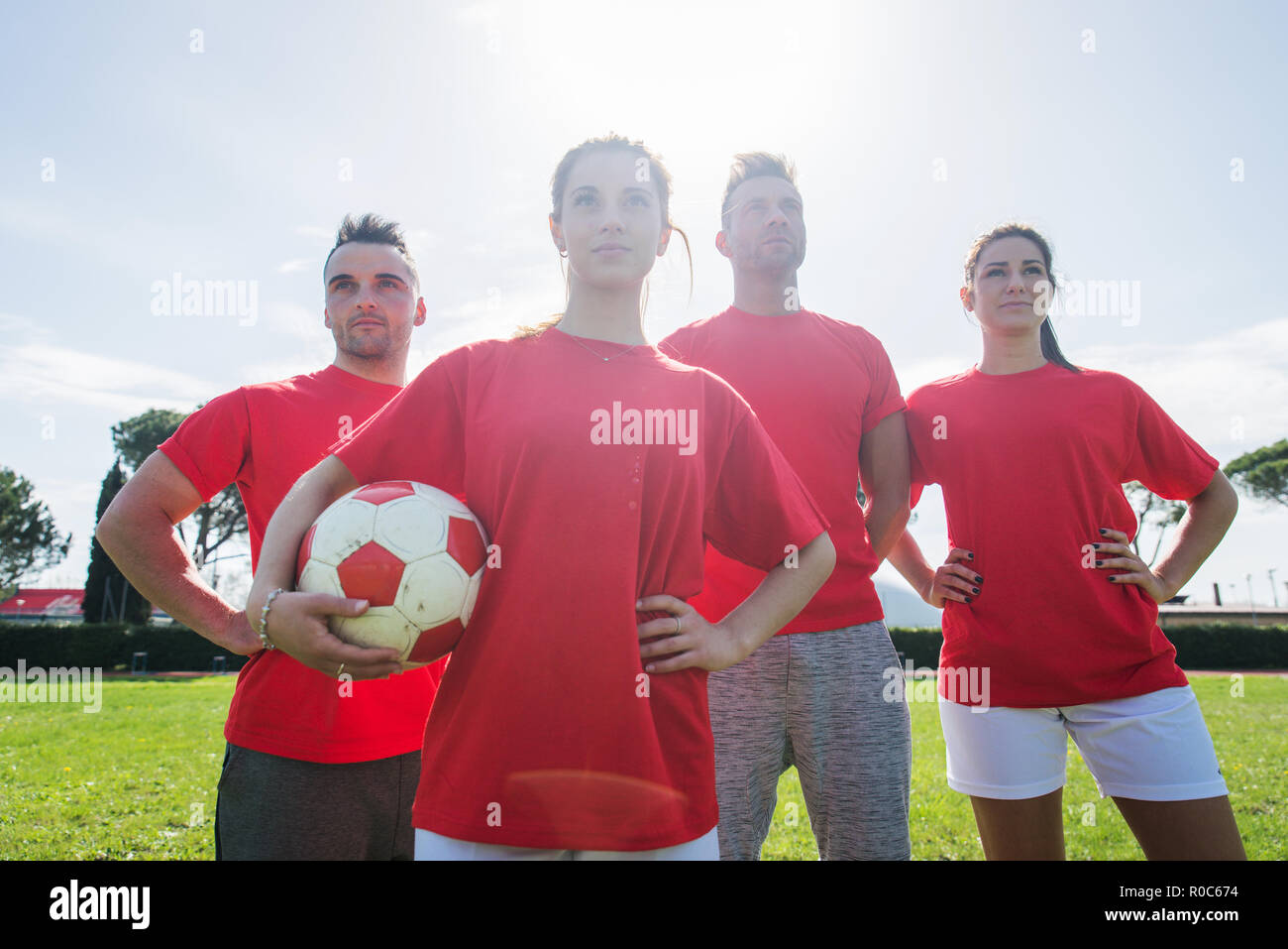 Football players training in soccer field, concepts about teamwork and ...