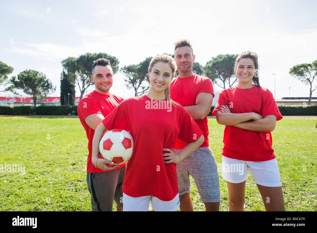 Football players training in soccer field, concepts about teamwork and ...